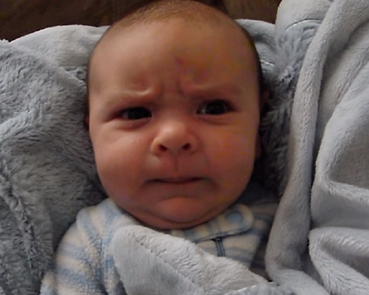 Sleepy Baby Frowns At Dad's Questions. -InspireMore.com