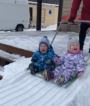 Toddlers Delighted By Homemade Snow Slide In Wholesome Video.